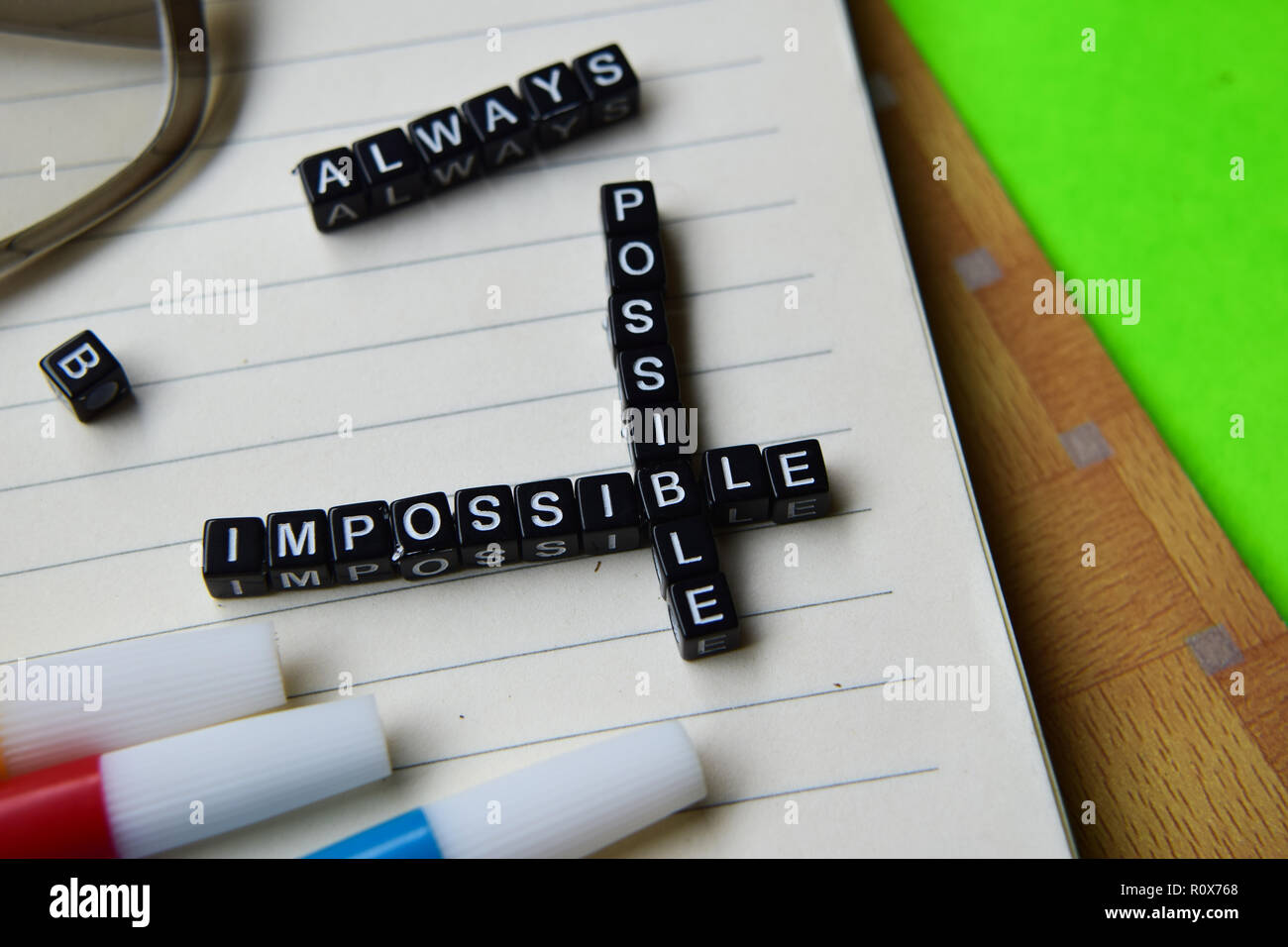 Always possible - impossible message written on wooden blocks ...