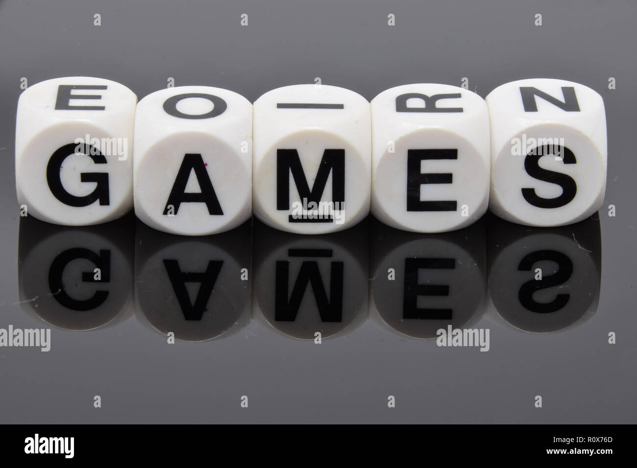 The word GAMES spelt out with letter dice Stock Photo - Alamy