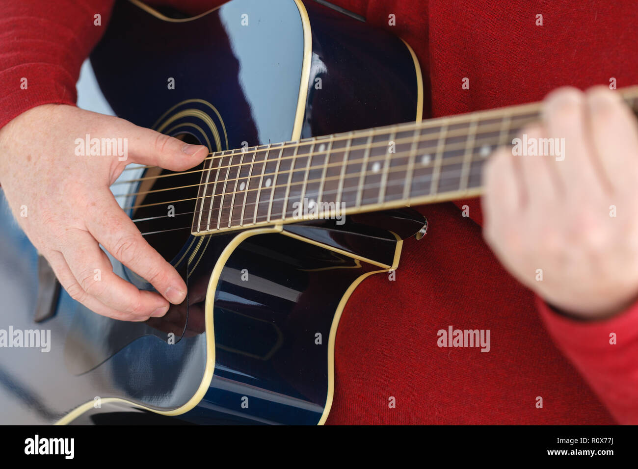 man's hands playing acoustic guitar Stock Photo - Alamy