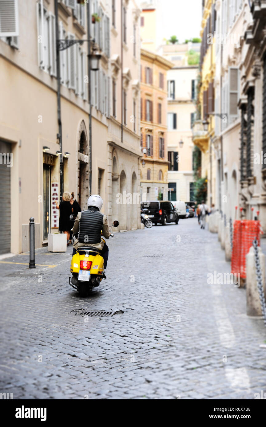 Man classic vespa scooter hi-res stock photography and images - Alamy