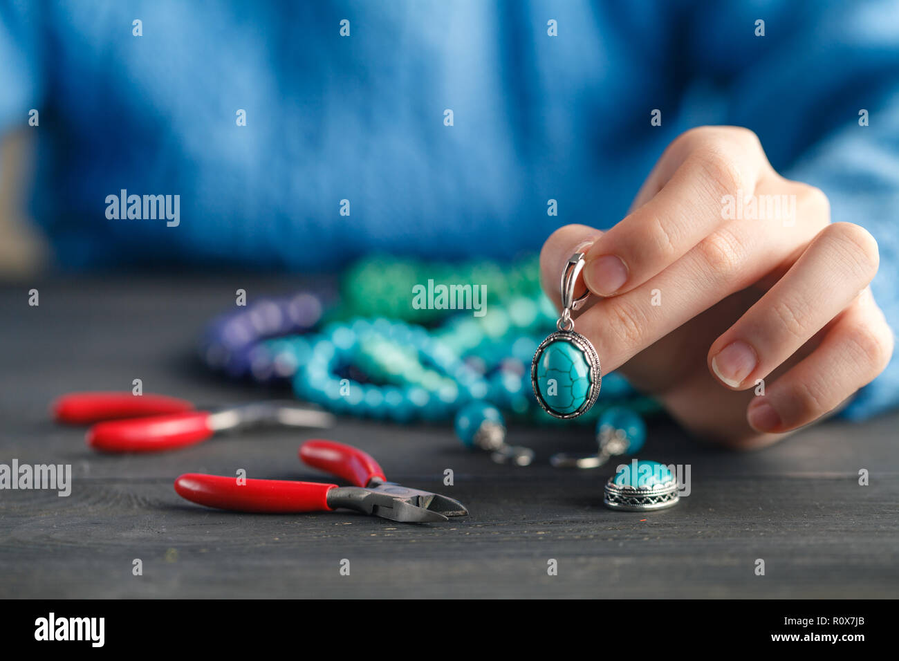 Female create handmade jewelry Stock Photo - Alamy
