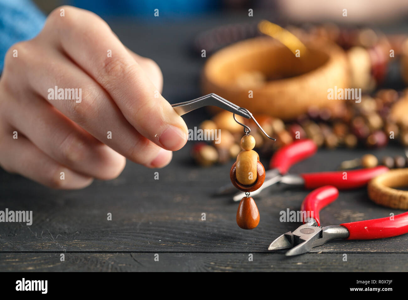 Female create handmade jewelry Stock Photo - Alamy