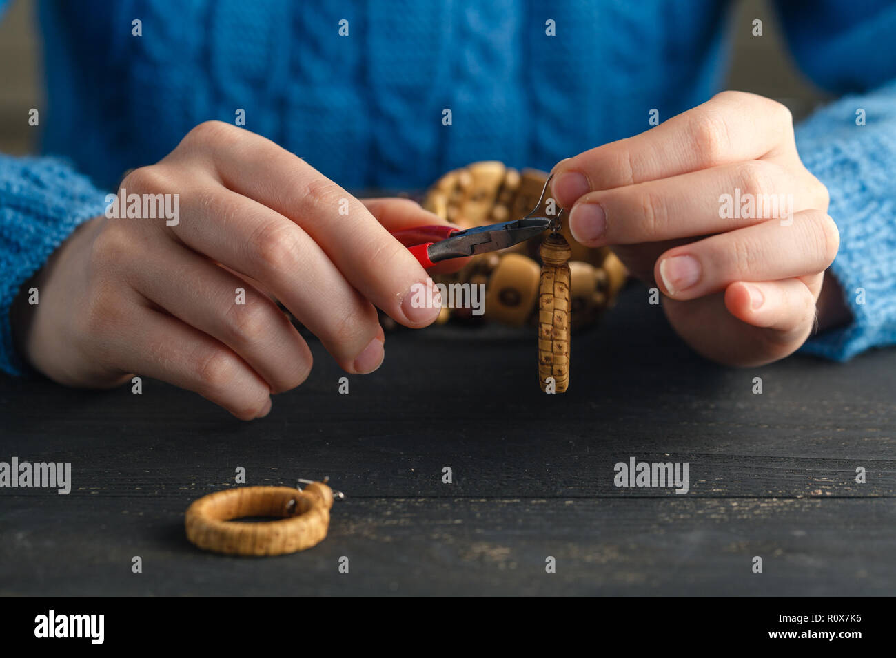 Female create handmade jewelry Stock Photo - Alamy