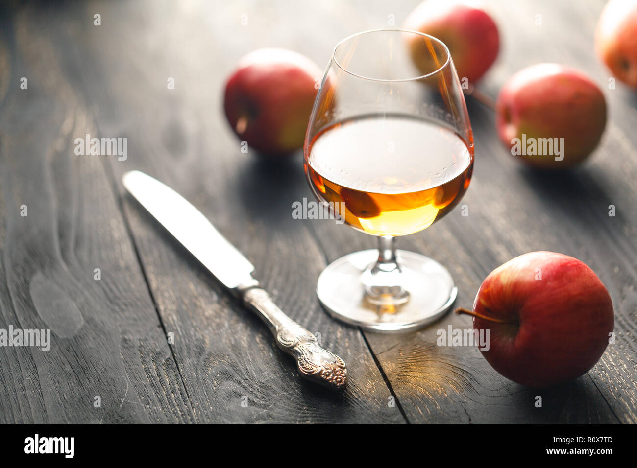 Glass of brandy on black background Stock Photo - Alamy