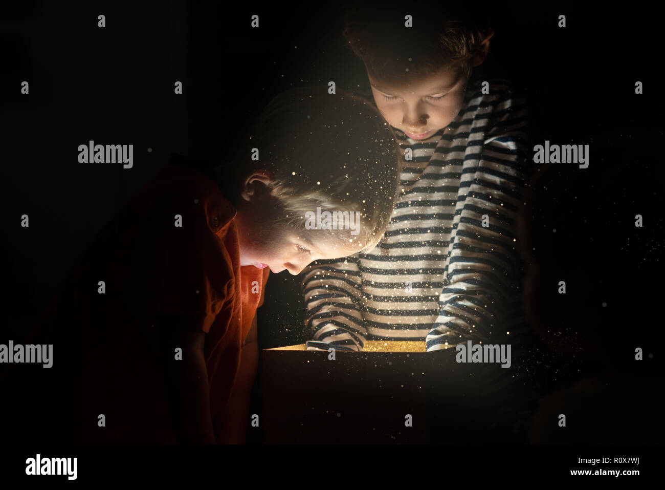 Kids reaching into box hi-res stock photography and images - Alamy