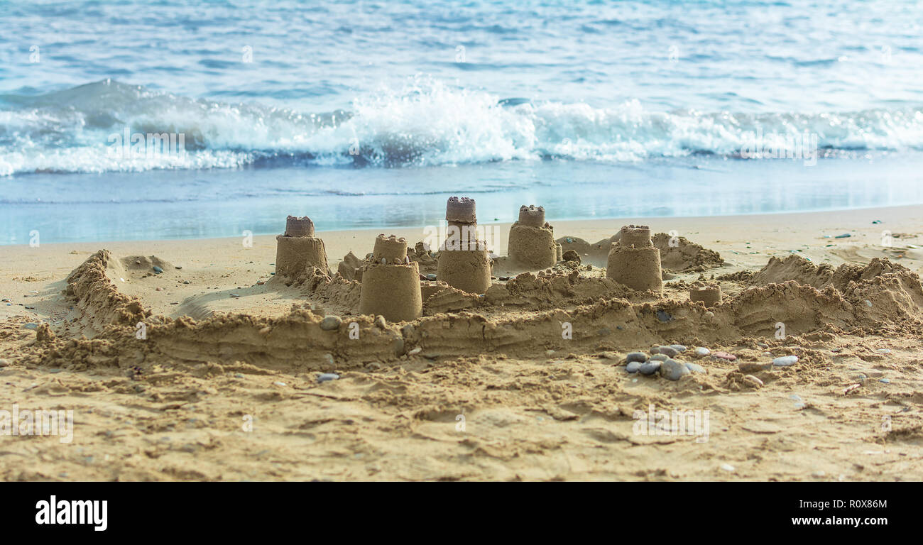 Sand castle on the beach near the surf line Stock Photo - Alamy