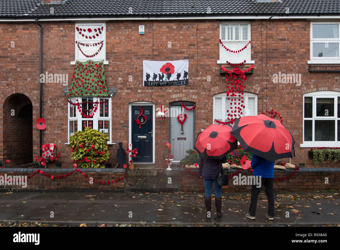 People look at a house in Station Road, Aldridge in Walsall which has ...