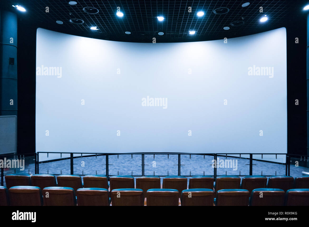 Empty stage in the small movie theater with white screen Stock Photo ...