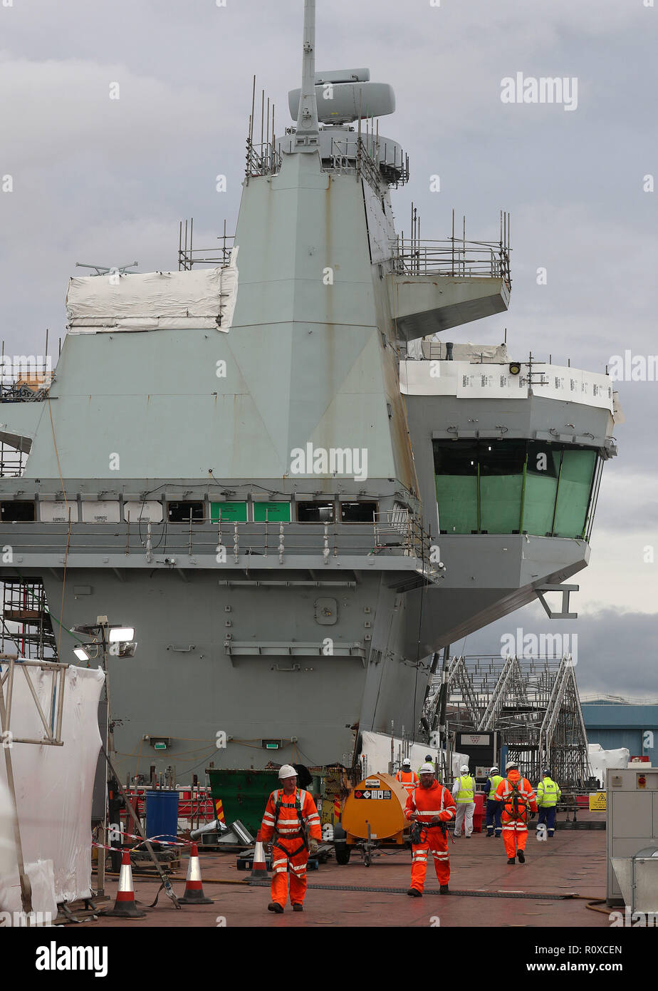 Work continues on the flight deck during a tour of the under ...