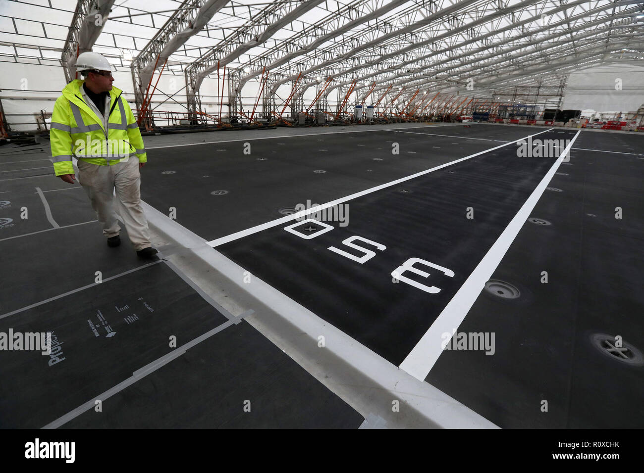 Gavin Rose from Aircraft Carrier Alliance views the thermal metal spray ...