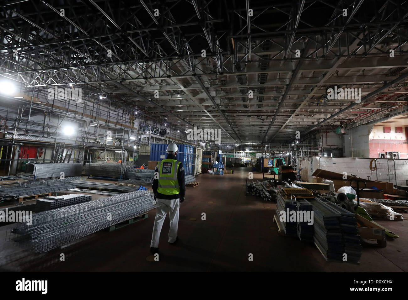 Work continues in the hanger area during a tour of the under ...