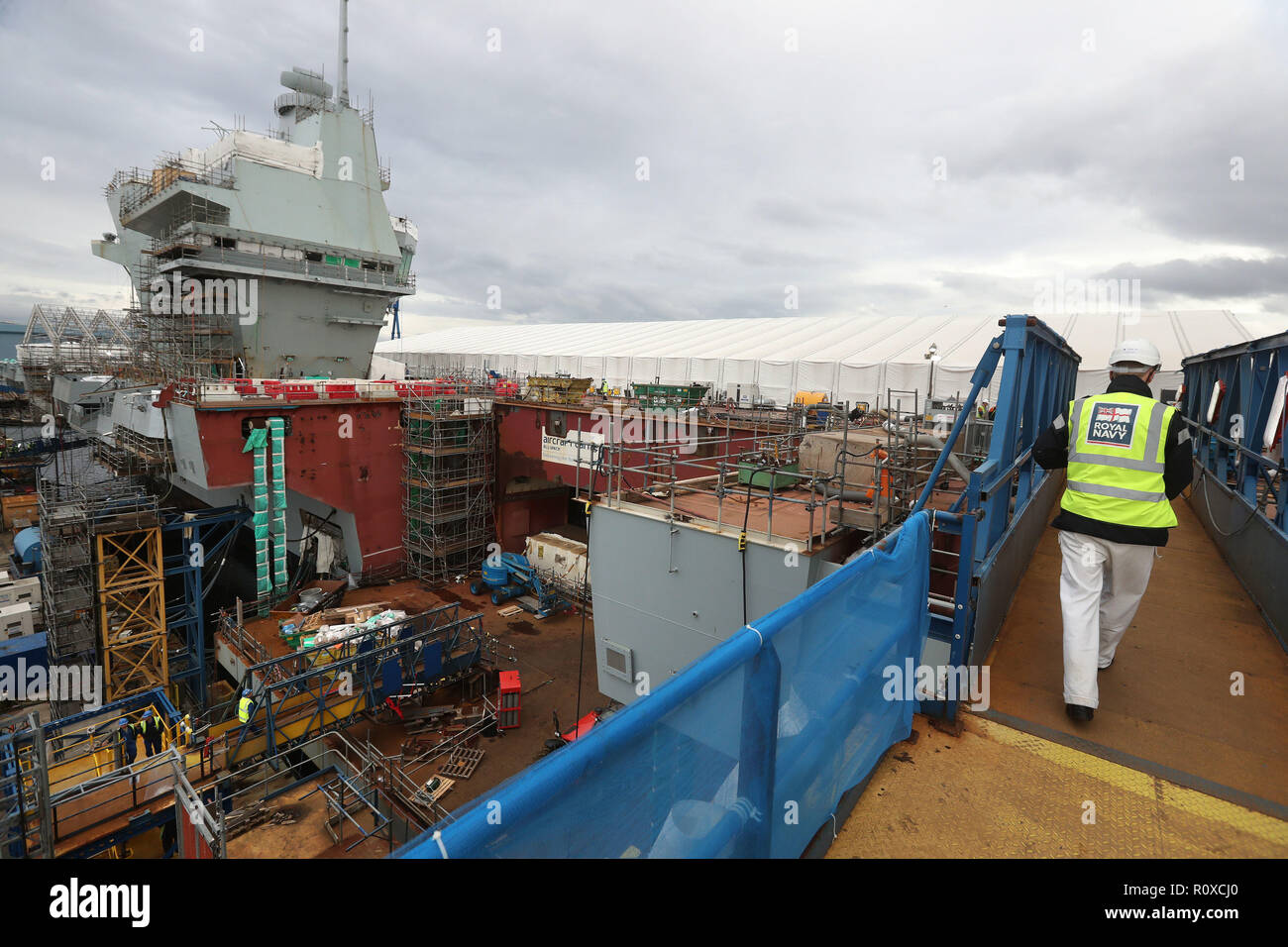 Work continues during a tour of the under-construction aircraft carrier ...