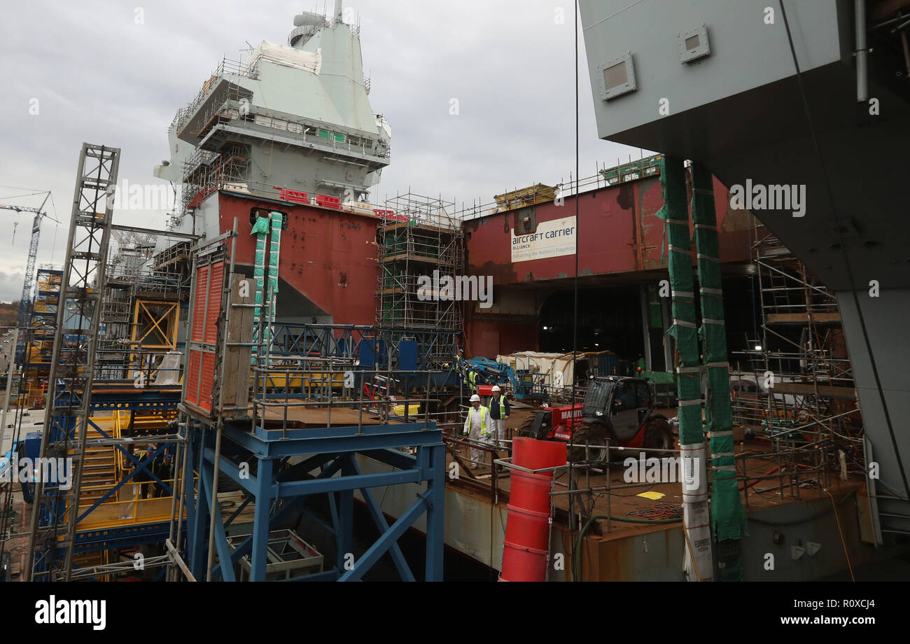 Work continues during a tour of the under-construction aircraft carrier ...