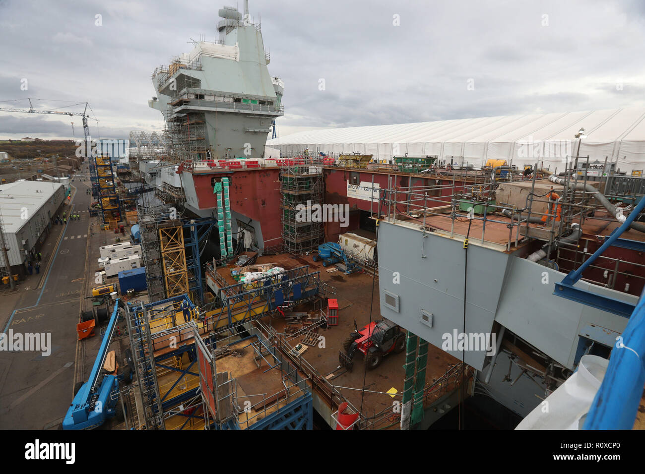 Work continues during a tour of the under-construction aircraft carrier ...