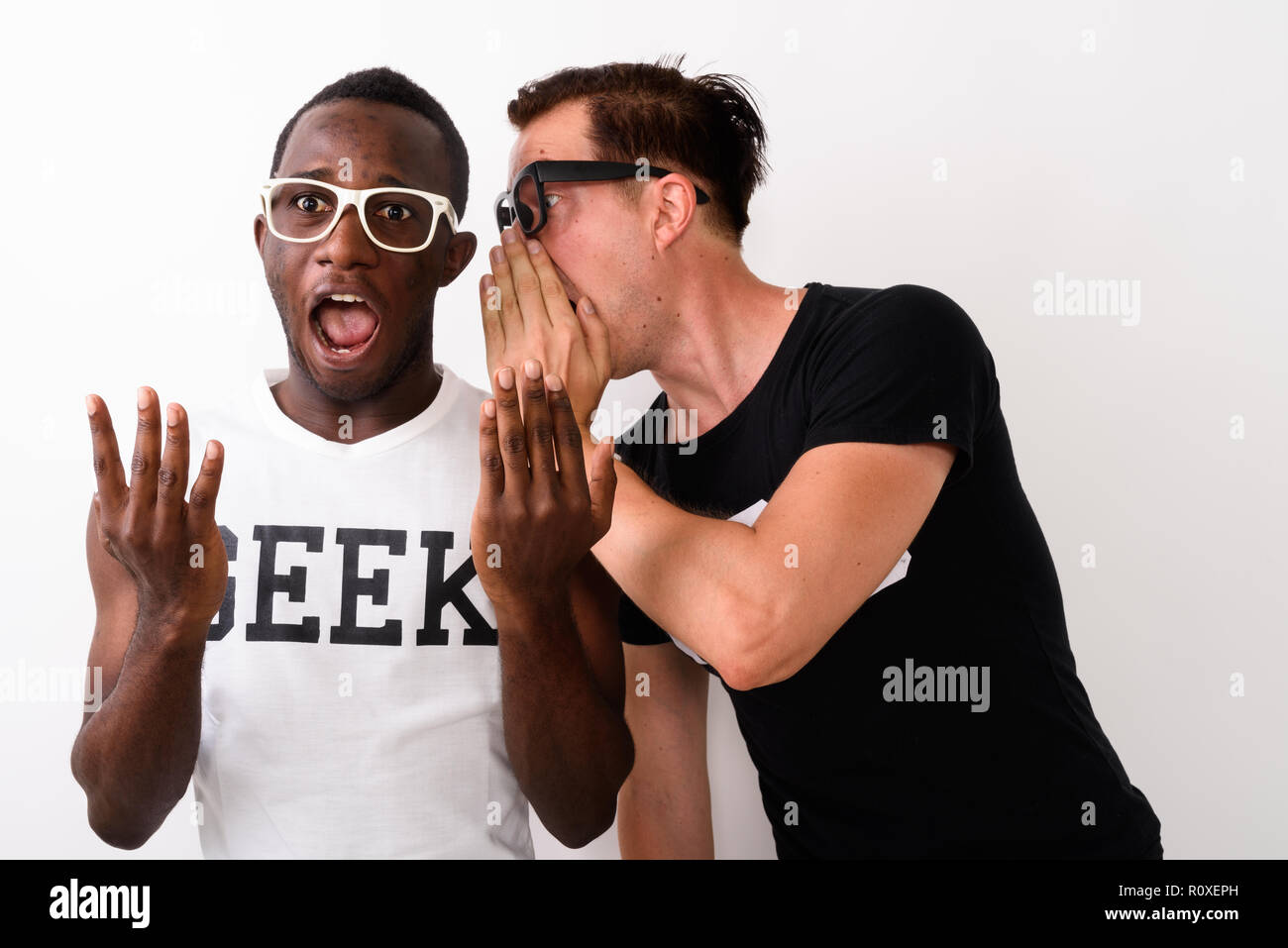 Studio shot of young black African Geek man listening while Euro Stock ...