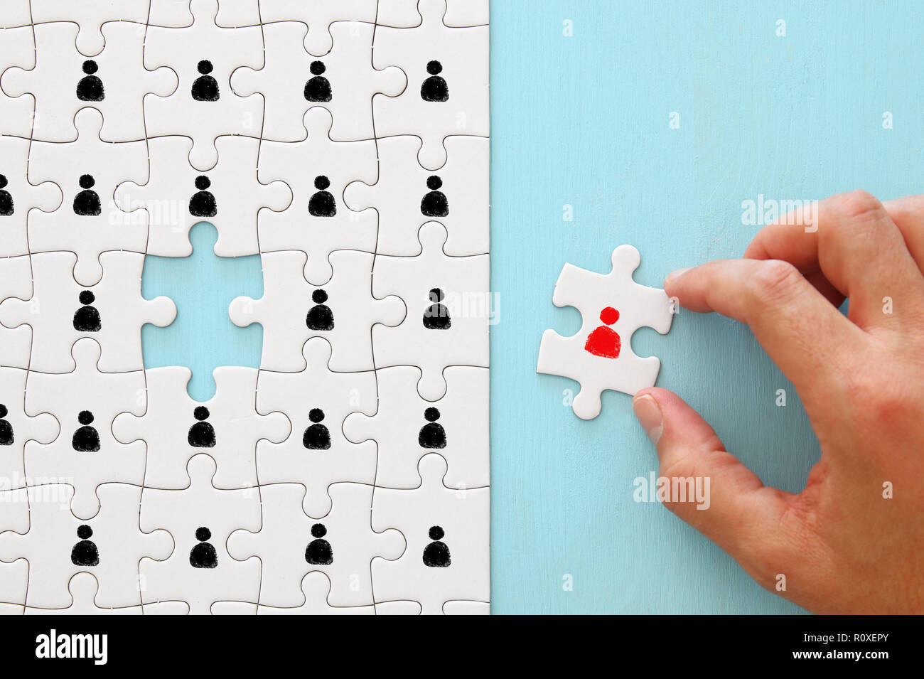 image of puzzle with people icons over wooden table ,human resources ...