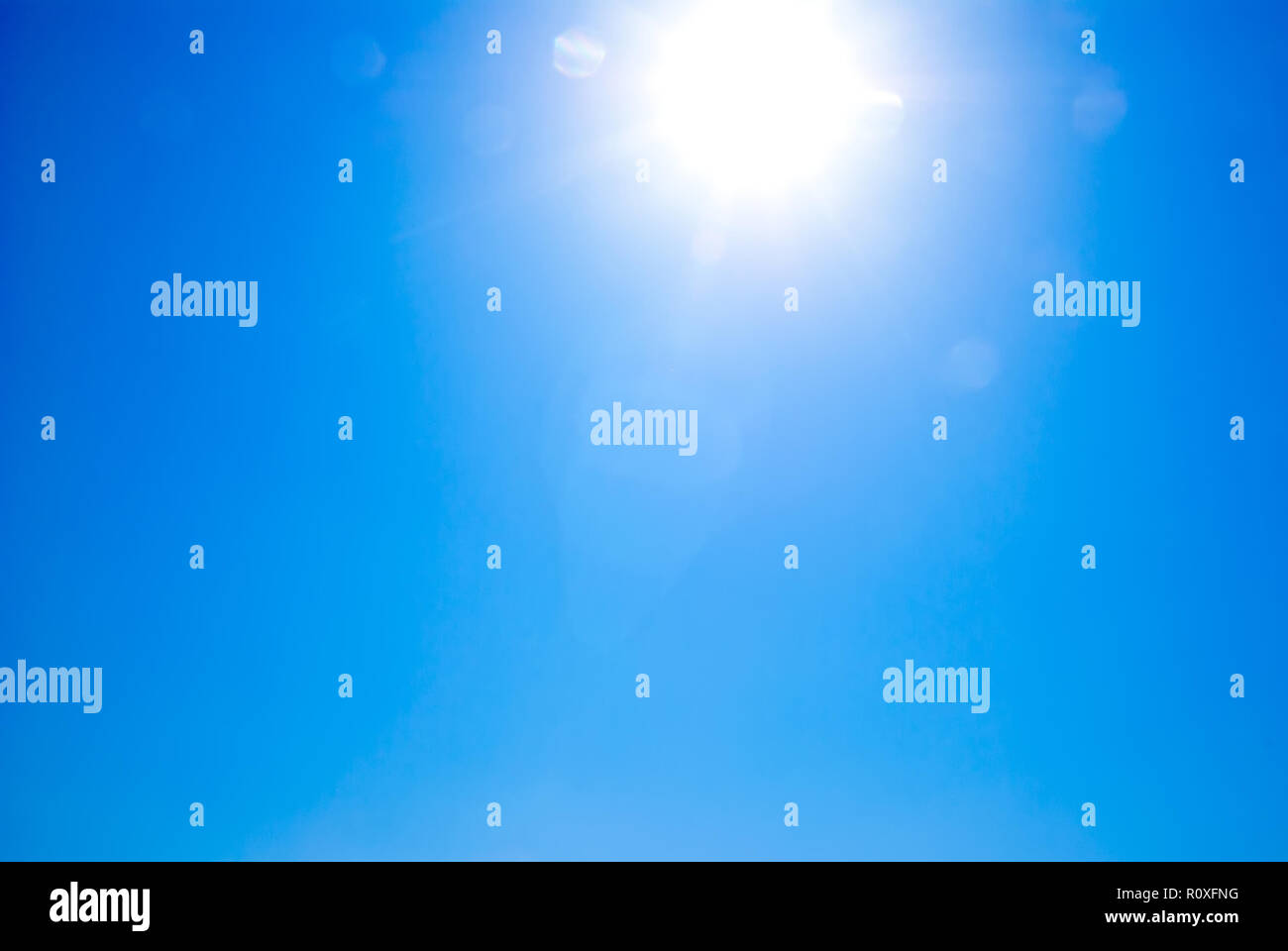 blue sky with bright sun Stock Photo - Alamy