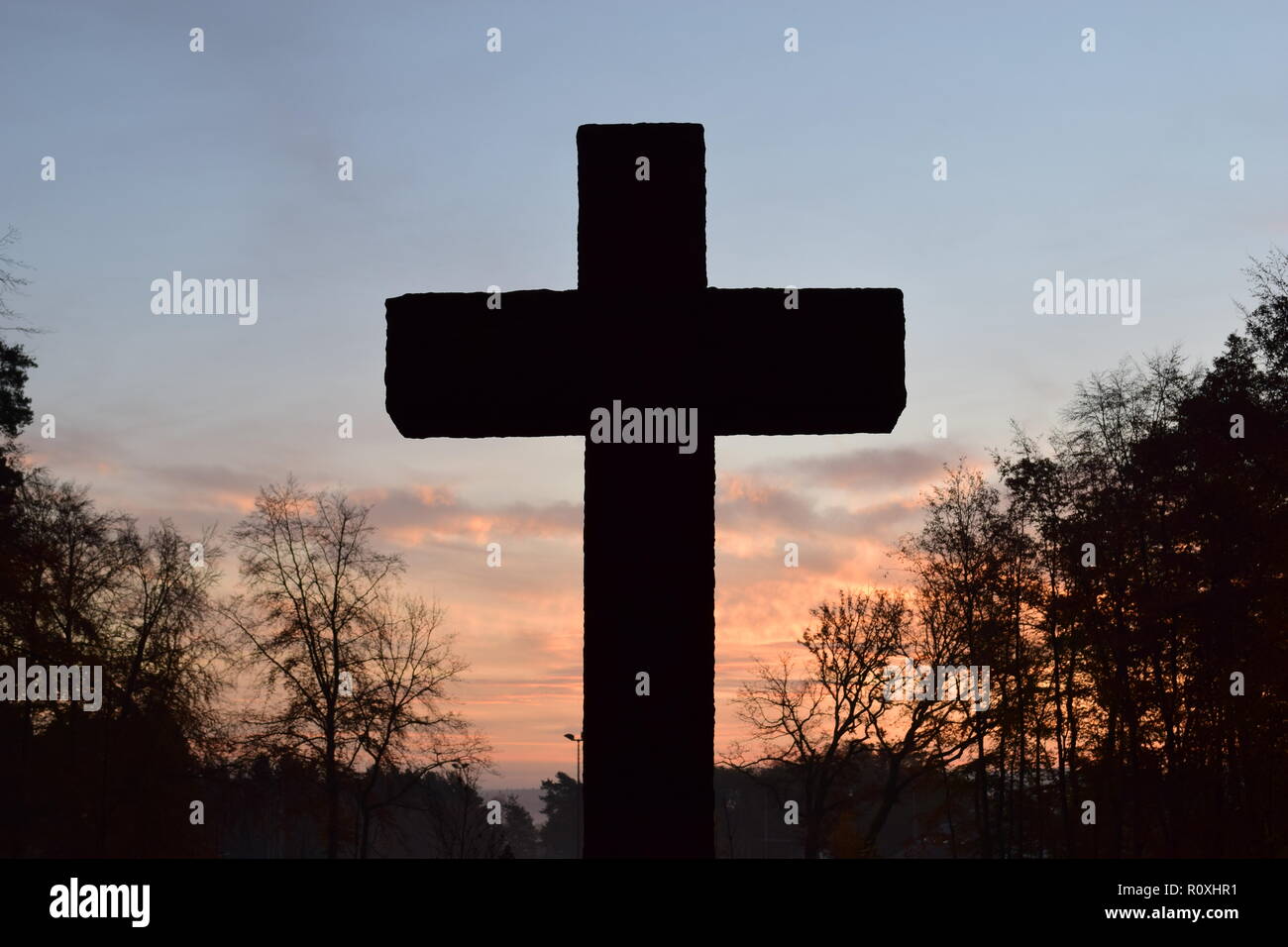 Timeline of the morning dusk sky viewed from behind a sand stone cross ...