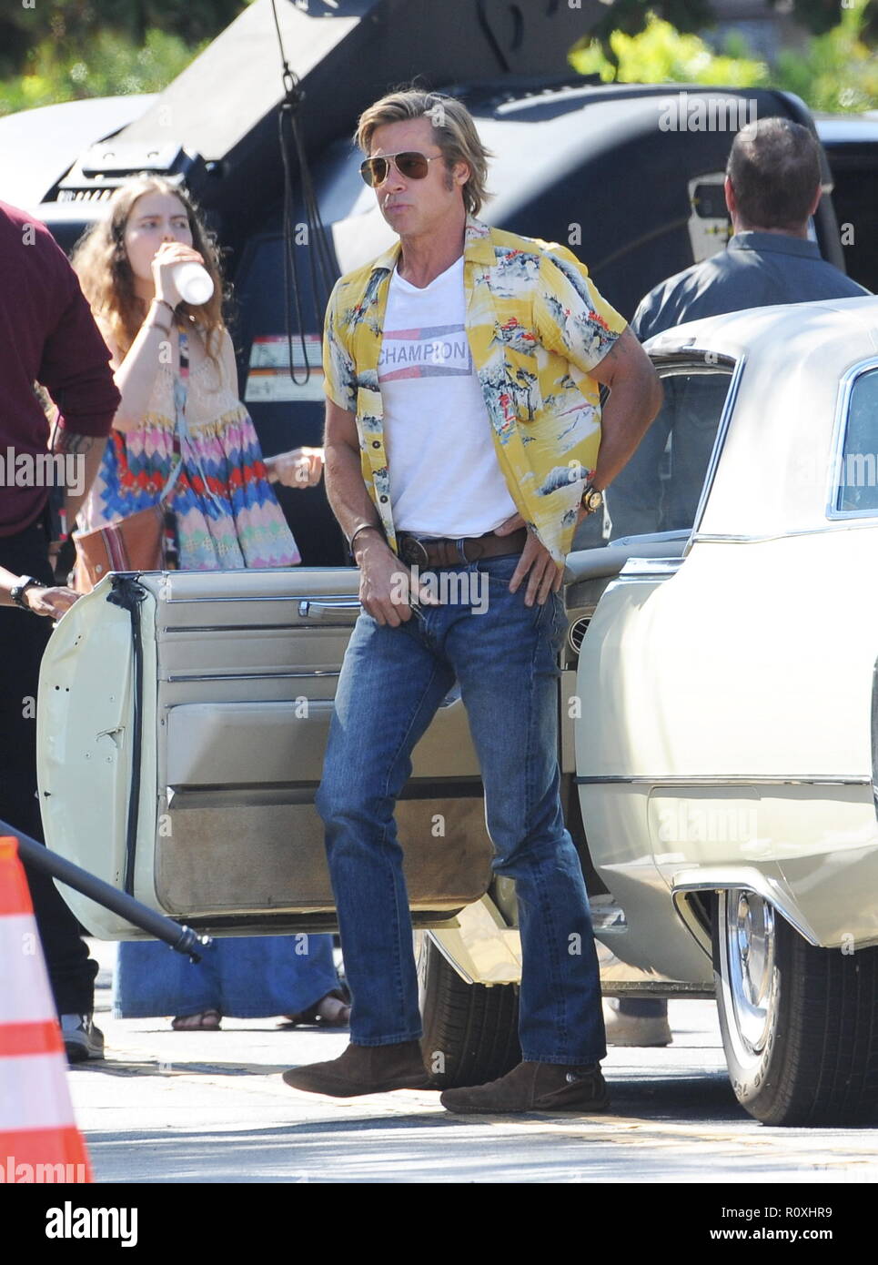 Brad Pitt sports 60's attire as her gets into his chararcter on the set ...