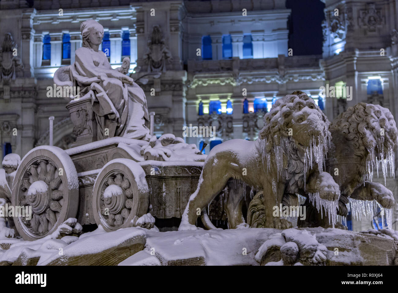 Cibeles fountain in the Plaza de Cibeles in winter with snow and icicle ...