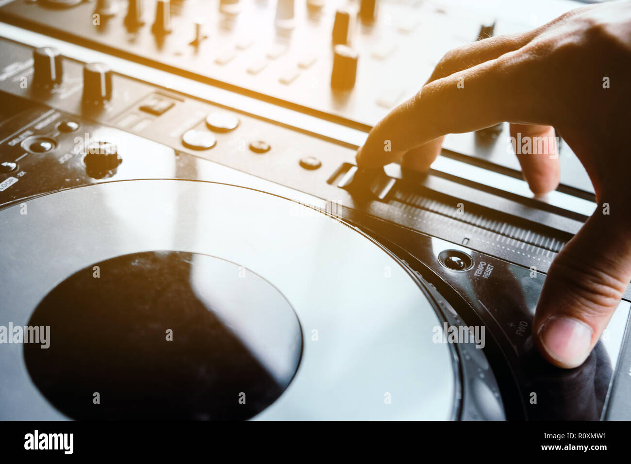 image of Dj playing music at mixer closeup Stock Photo - Alamy