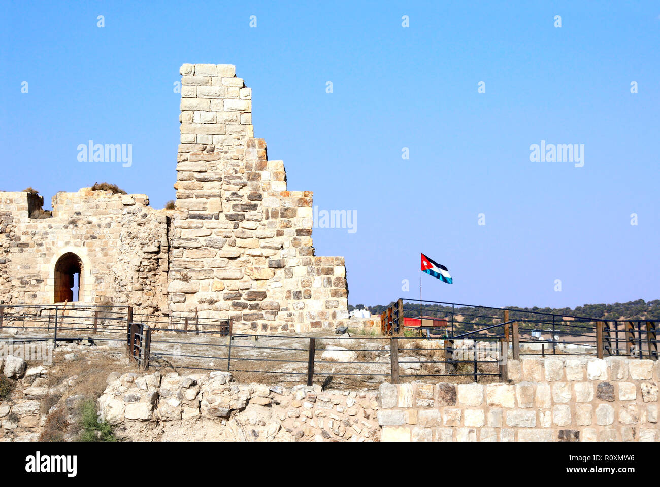Flag of Jordan and stone wall in medieval crusaders castle, Al Karak ...