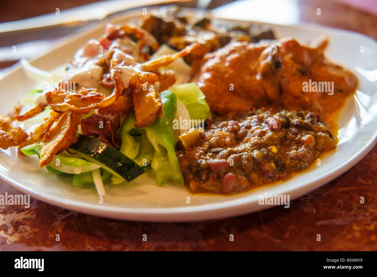 Authentic Indian cuisine buffet plate with tikka masala birista fried ...