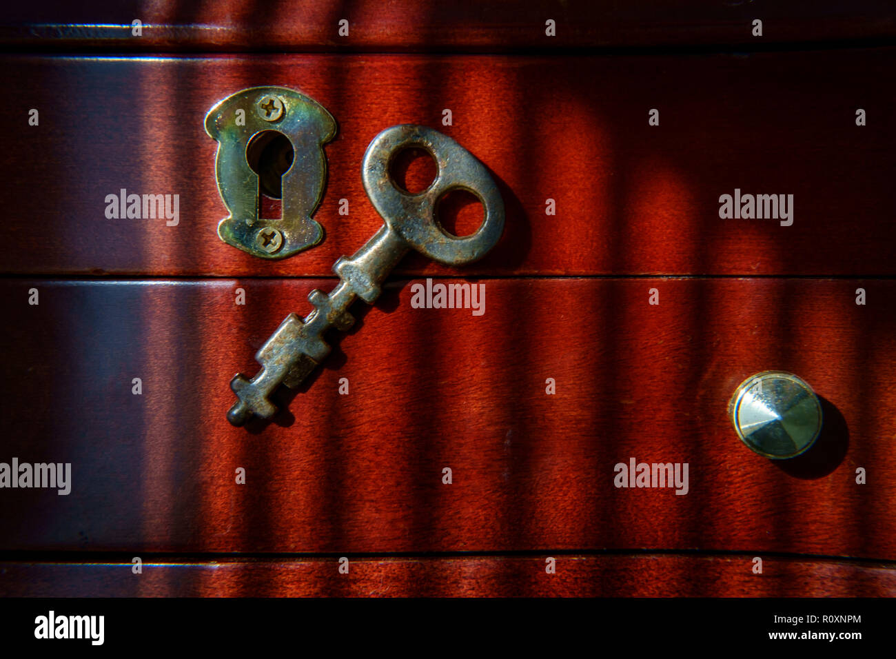 Old antique skeleton key on distressed textured wooden background Stock ...