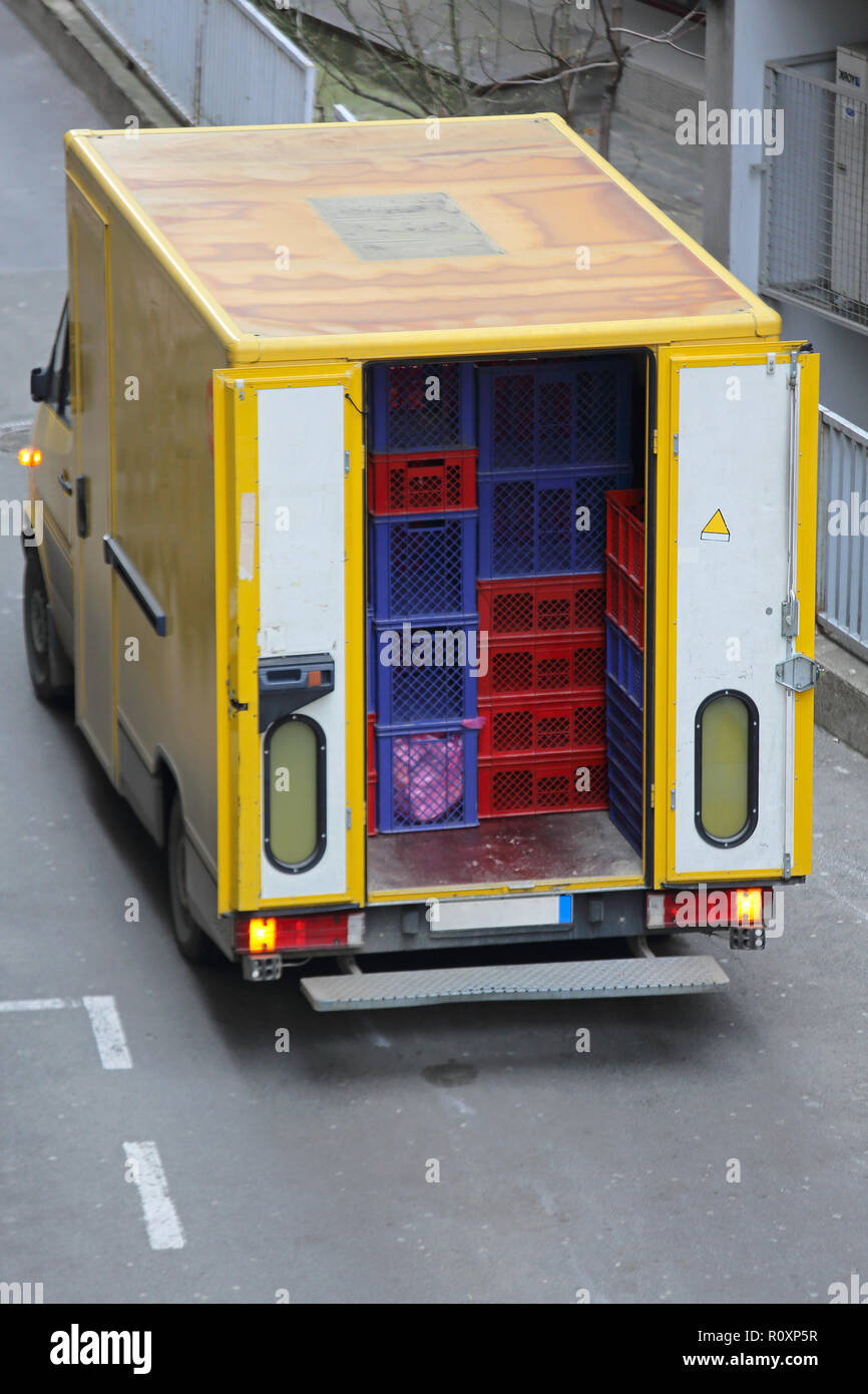 Yellow Delivery Van With Rear Door Open Stock Photo - Alamy