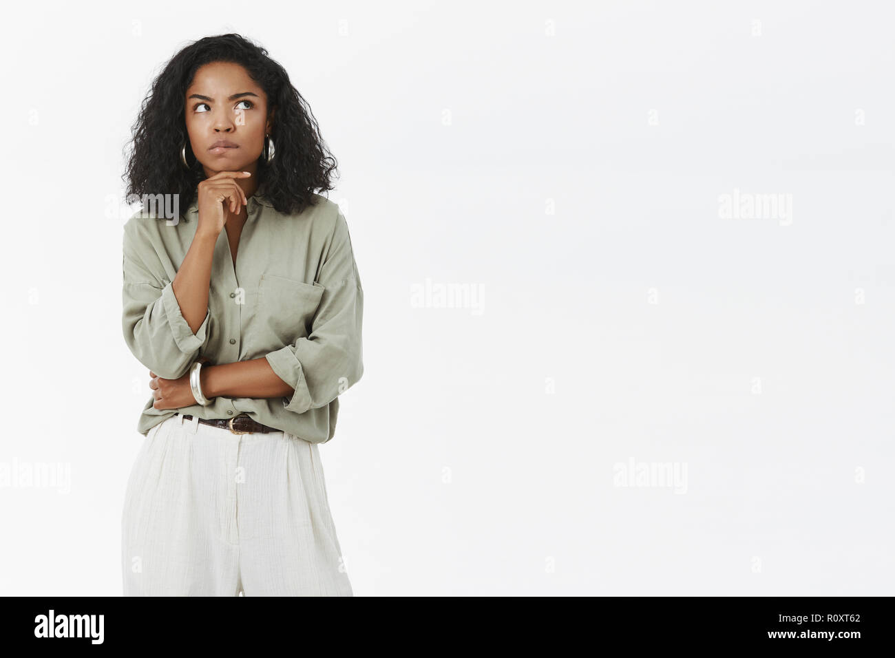 Woman thinking how get rid of troubles. Intense smart and thoughtful ...