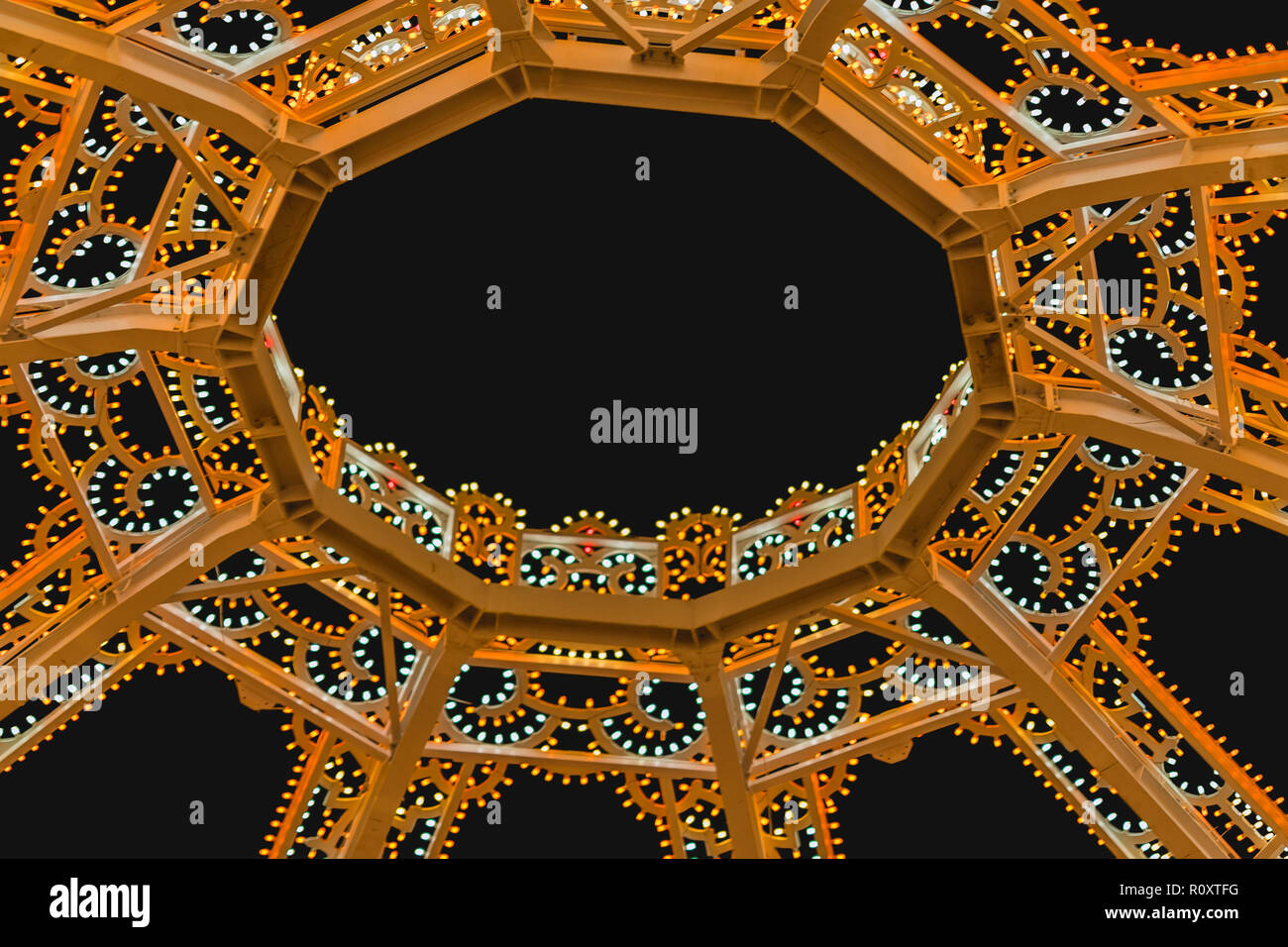 Illuminated round openwork decorative arch. Modern interior design of ...