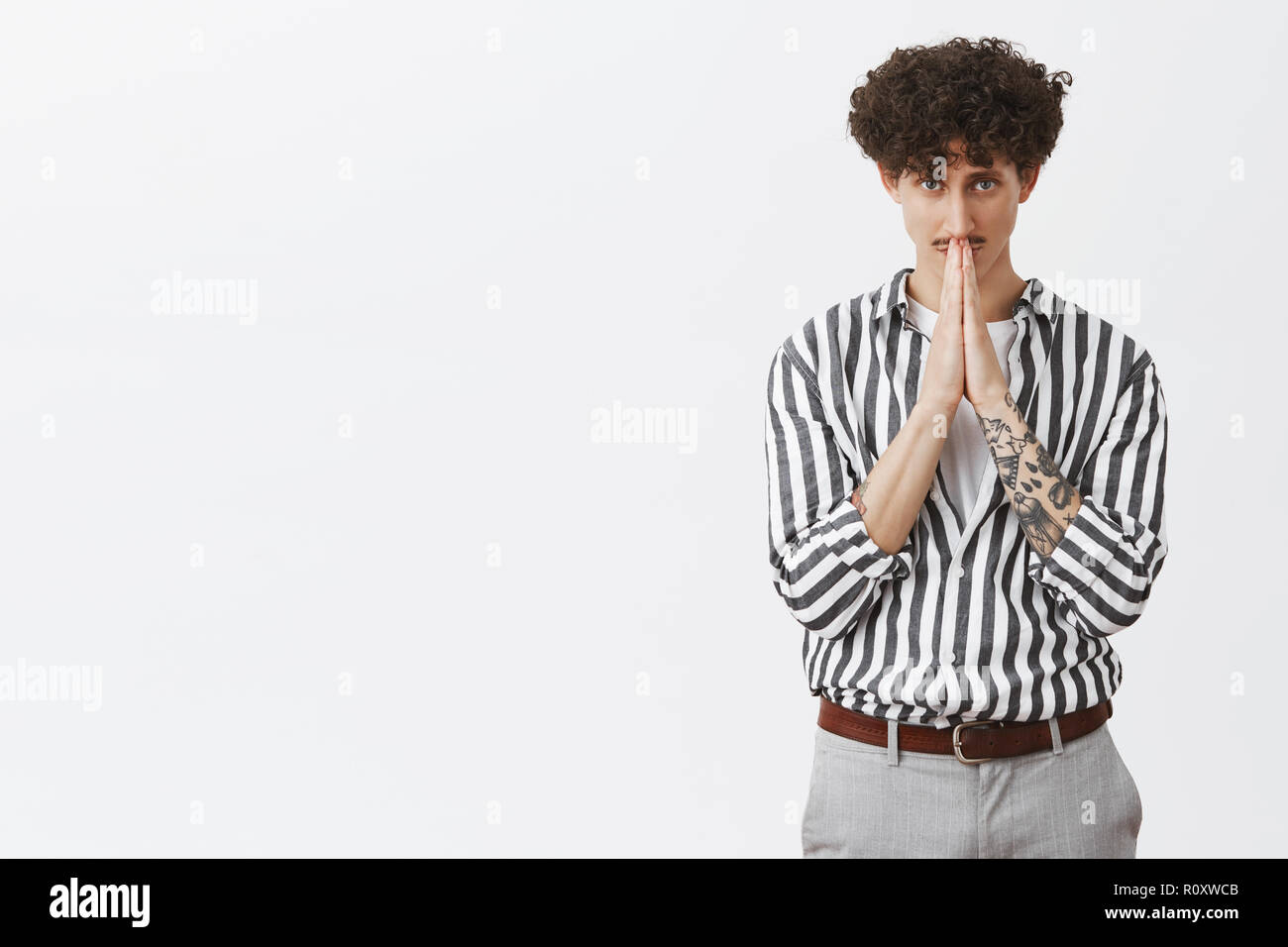 Please have mercy. Guy asking for help bagging with hands in pray over ...