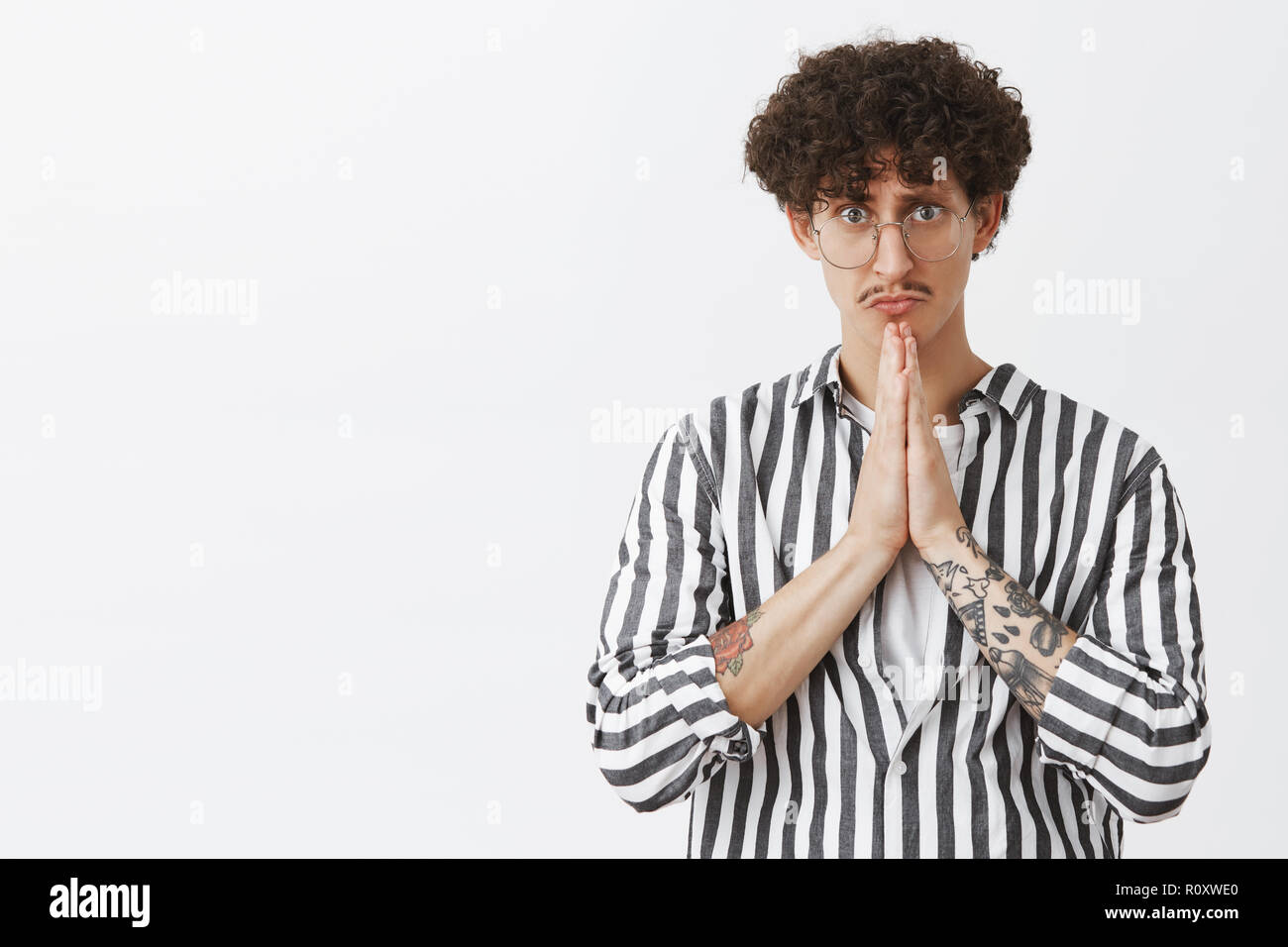 Portrait worried curly man praying hi-res stock photography and images ...