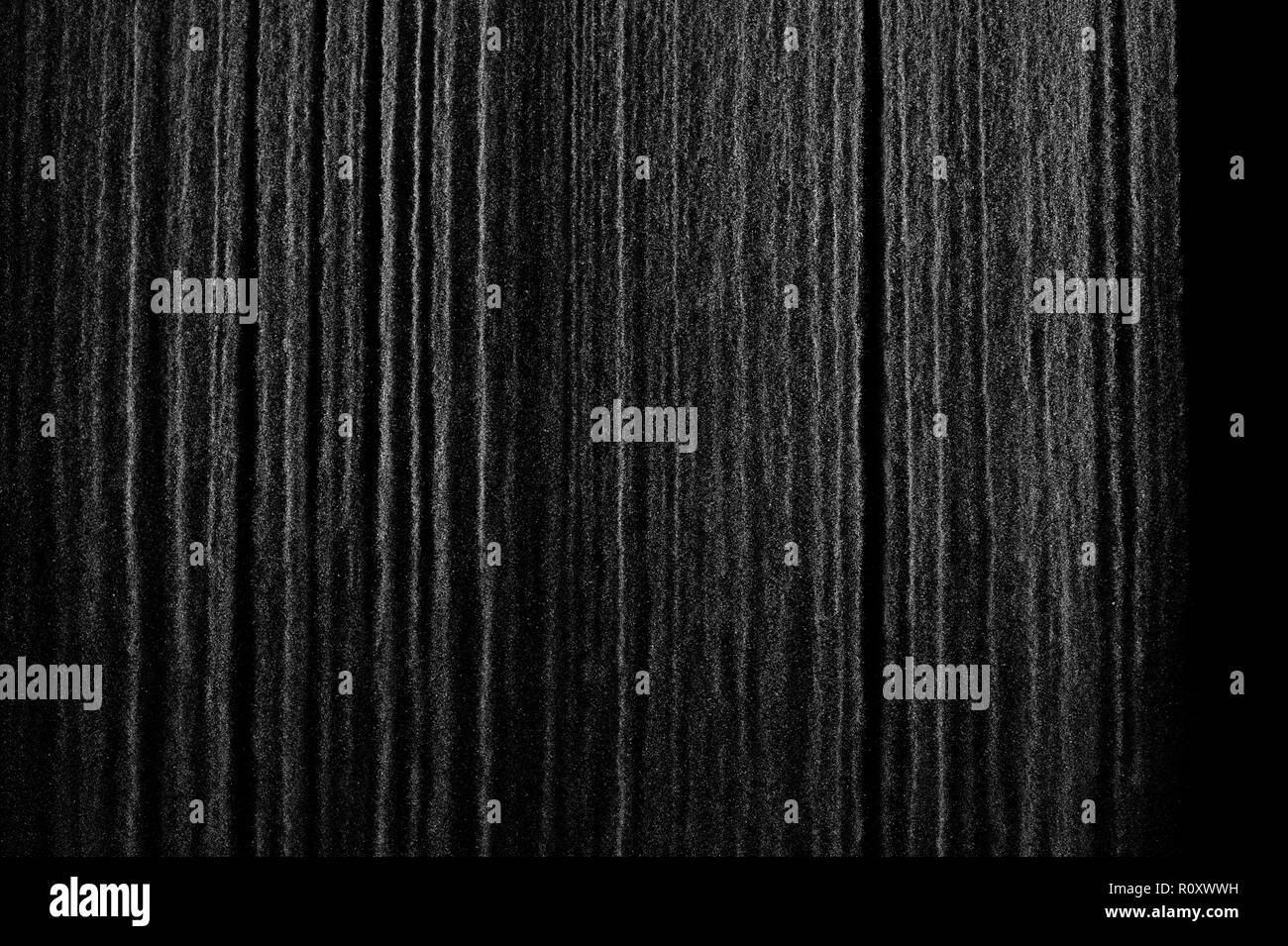 Freeze motion of white particles on black background. Powder explosion ...