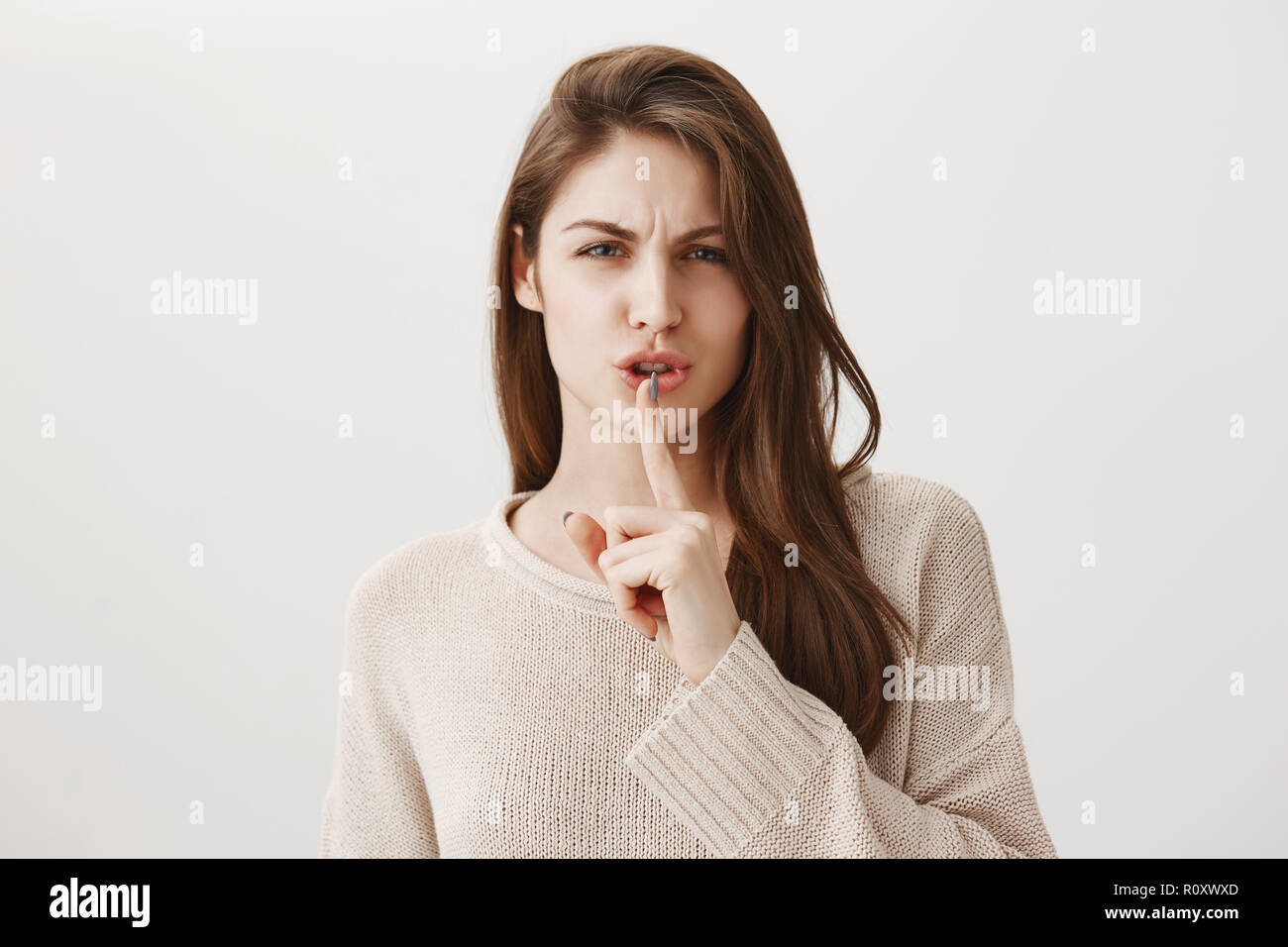 Woman mystery shh hi-res stock photography and images - Alamy