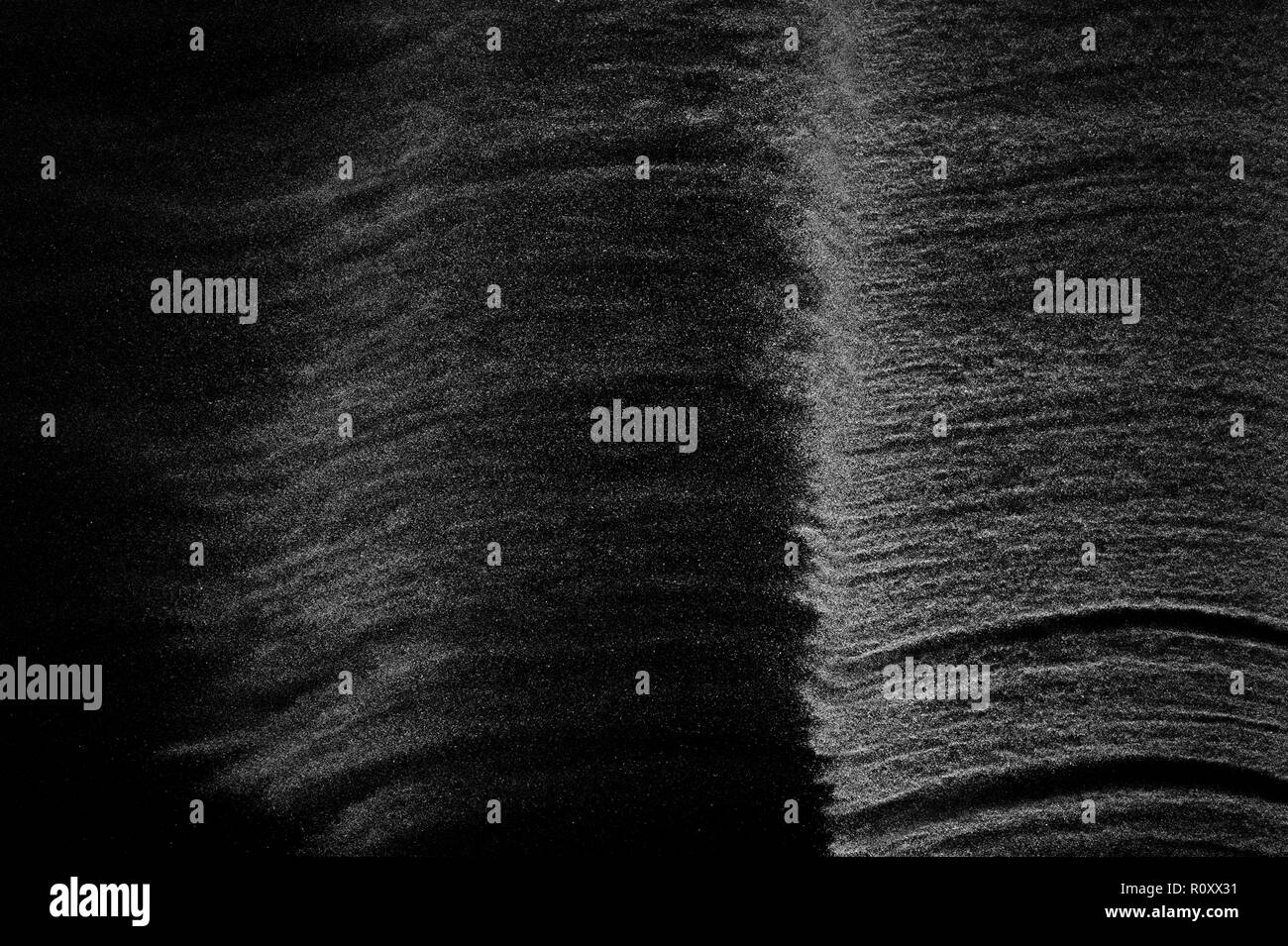 Freeze motion of white particles on black background. Powder explosion ...