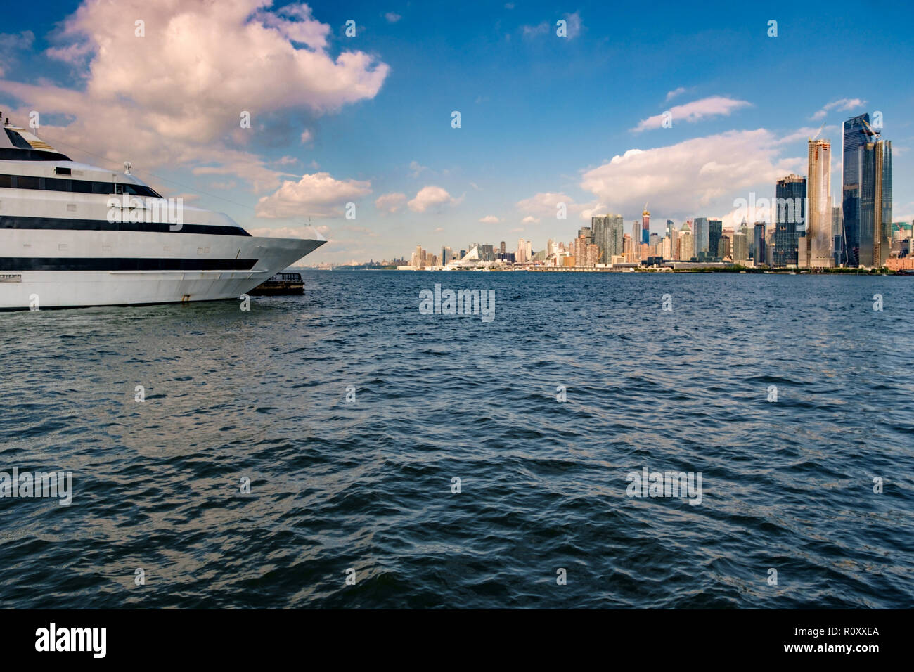 Cruise ship NYC skyline against summer blue sky Stock Photo - Alamy
