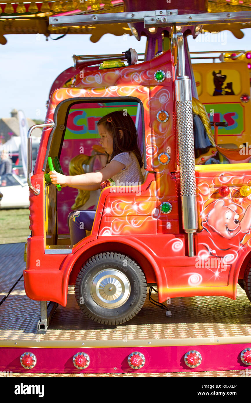 Children enjoying a funfair ride hi-res stock photography and images ...