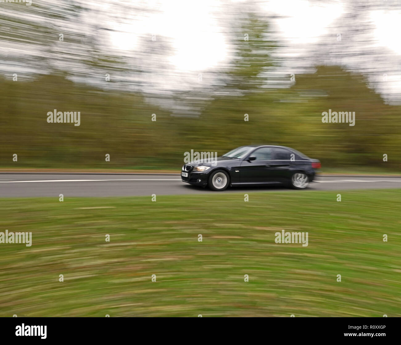 Car driving fast hi-res stock photography and images - Alamy