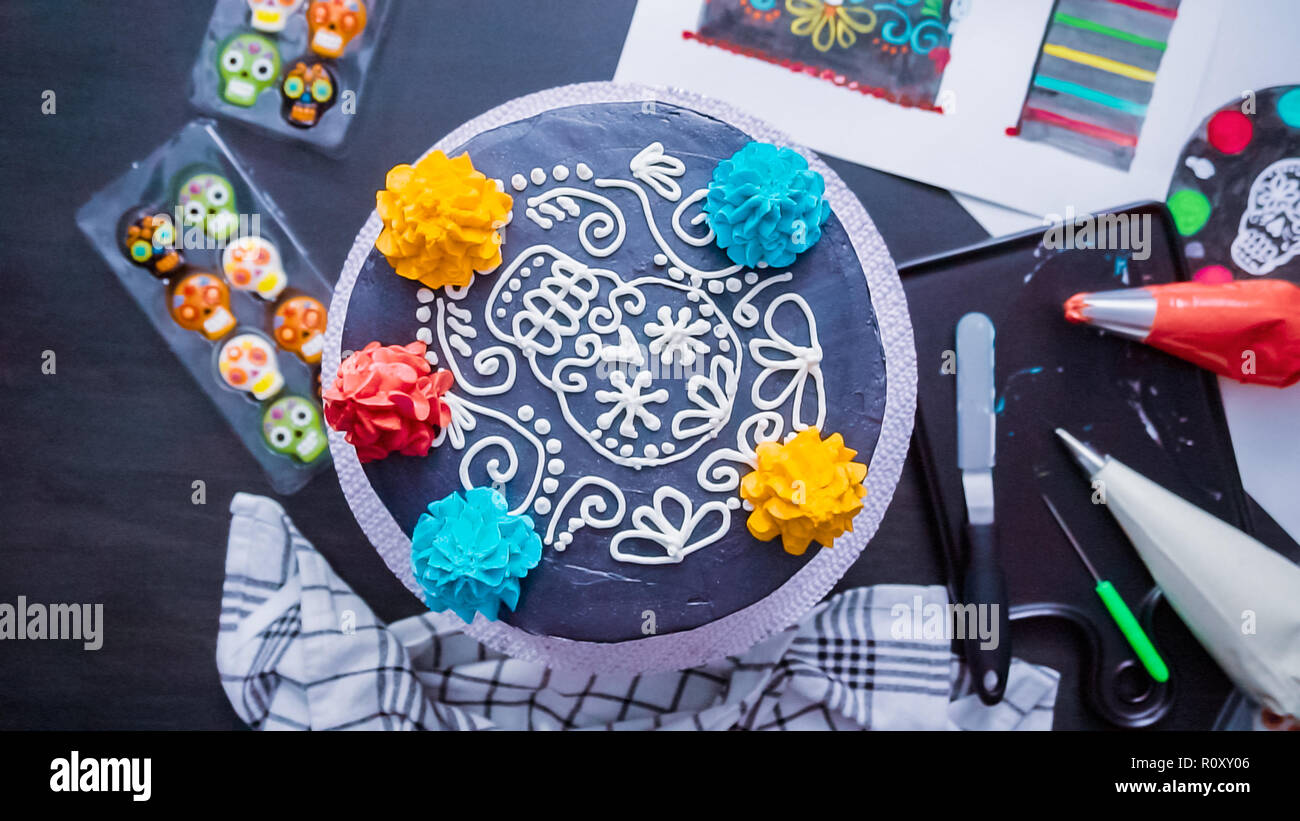 Step by step. Flat lay. Baker piping colorful buttercreal italian icing ...