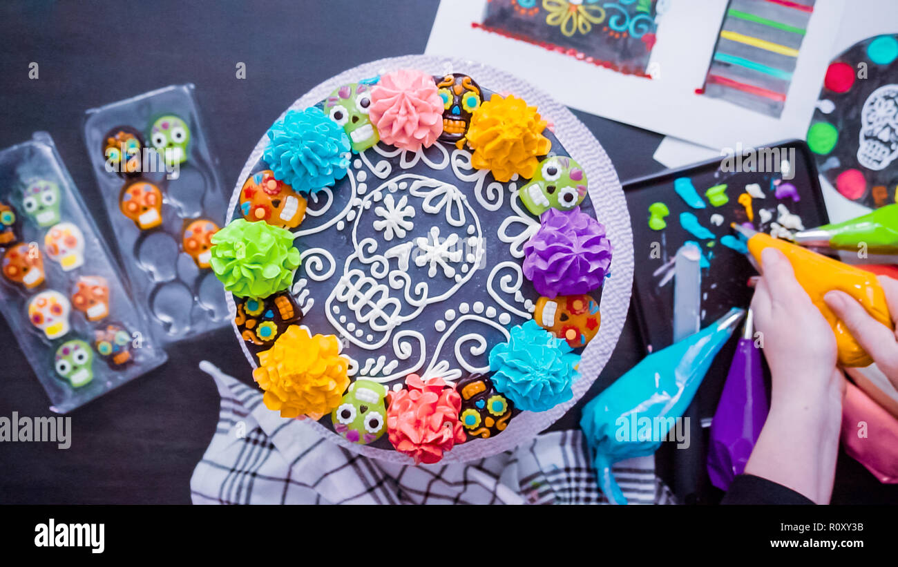 Step by step. Flat lay. Baker decorating multilayer chocolate cake with ...