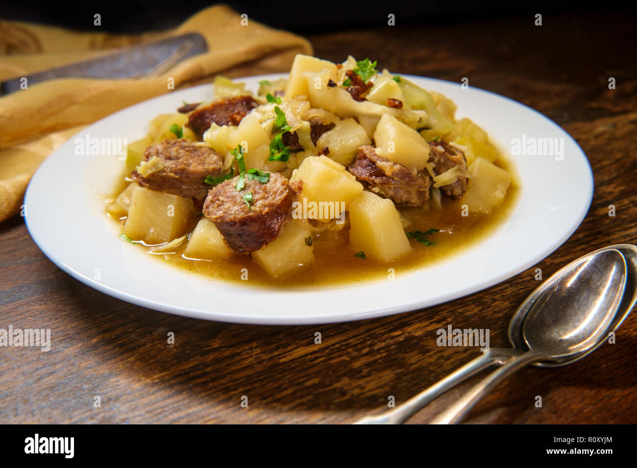 Hearty German Oktoberfest stew with beer bratwurst shredded cabbage and ...
