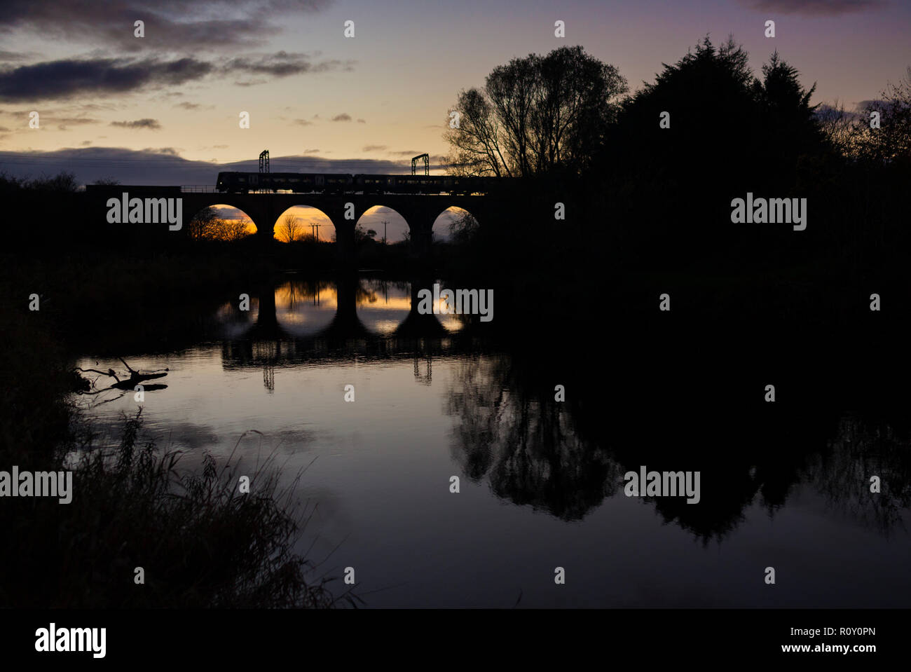 A Scotrail class 380 electric train crossing Garnock Longford viaduct ...