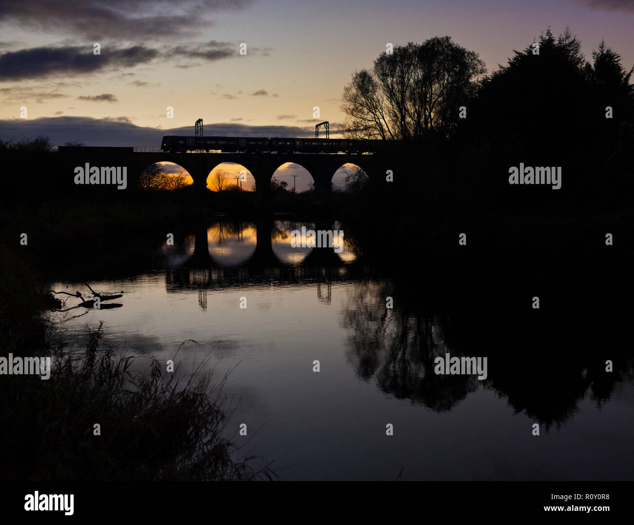 A Scotrail class 380 electric train crossing Garnock Longford viaduct ...