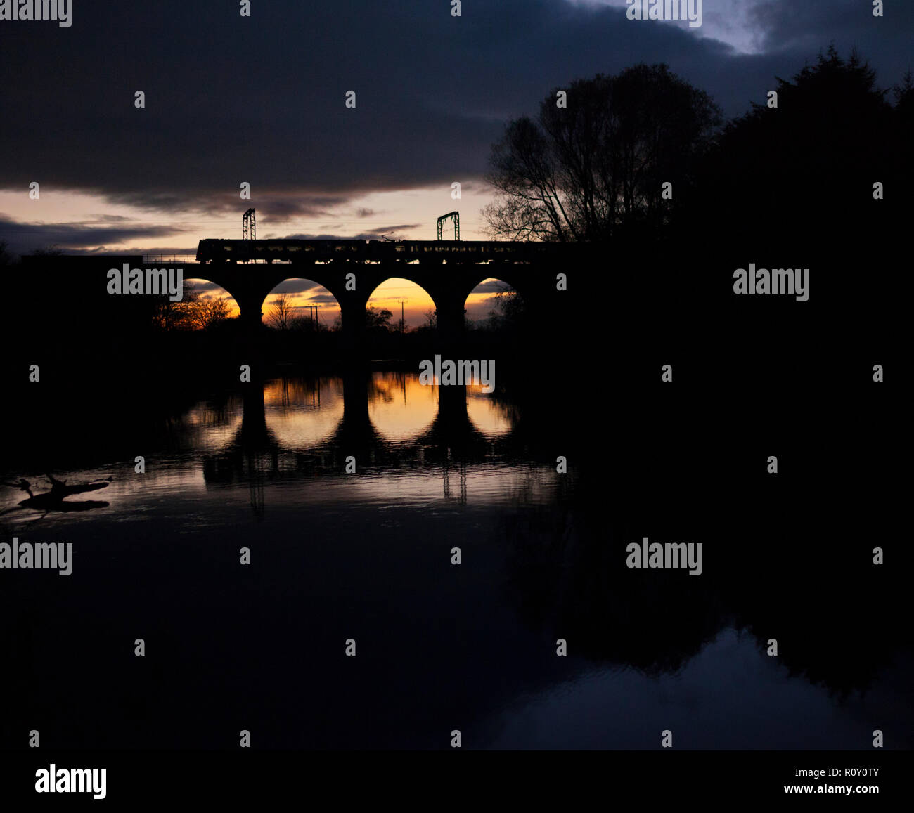 A Scotrail class 380 electric train crossing Garnock Longford viaduct ...