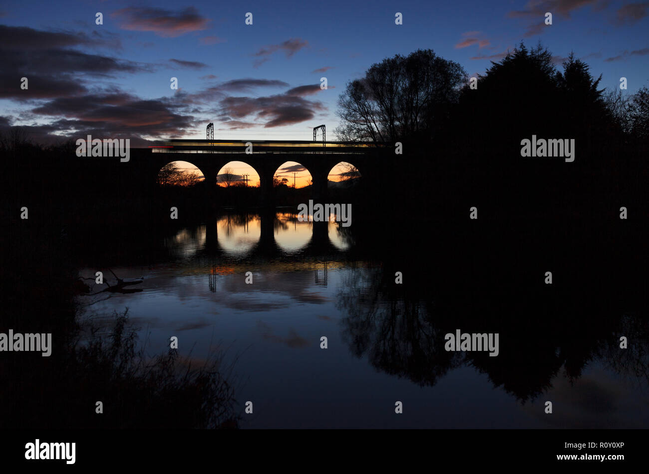 A Scotrail class 380 electric train crossing Garnock Longford viaduct ...
