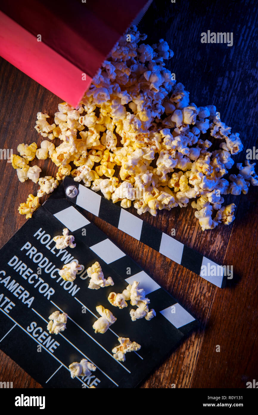 Movie theater popcorn with butter and blue backlighting Stock Photo - Alamy