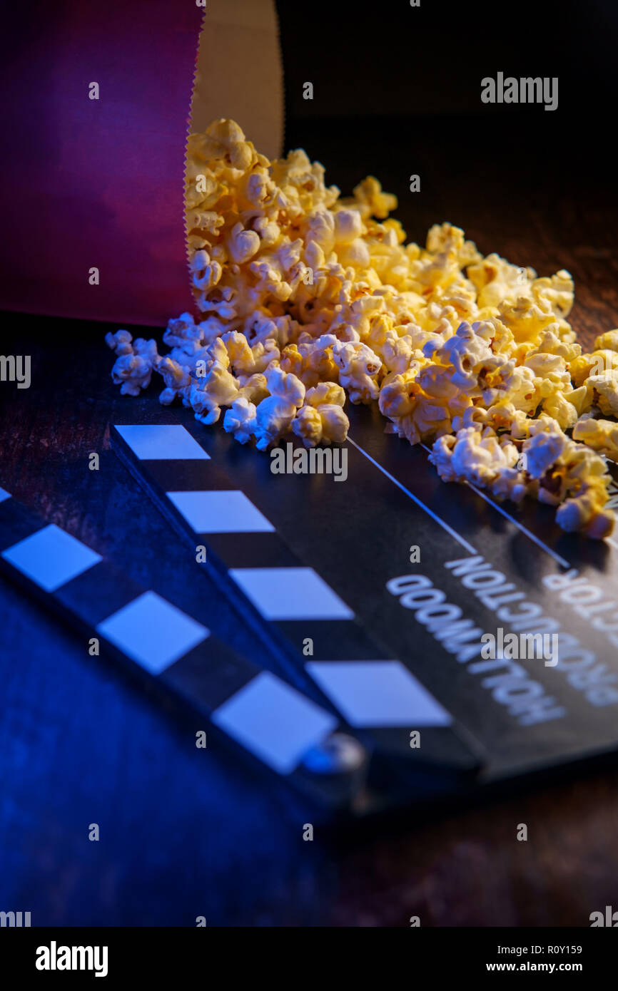 Movie theater popcorn with butter and blue backlighting Stock Photo - Alamy
