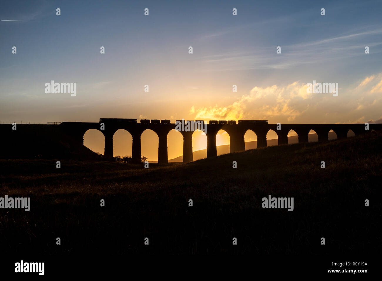 2 Direct rail services class 66 locomotives passing Ribblehead viaduct ...