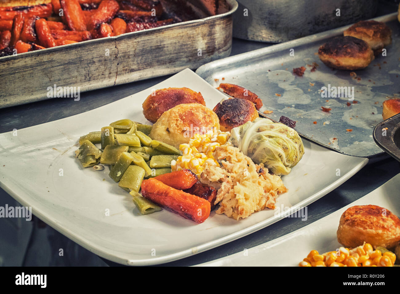Plate of cooked vegetables from a busy commercial kitchen, a healthy ...